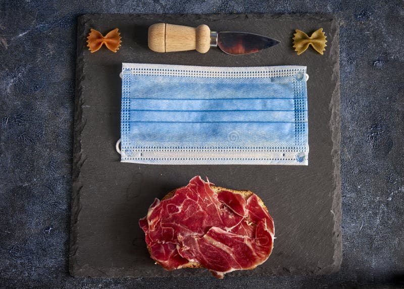 Ham and mask aperitif day stock image. Image of pigskin - 202465757