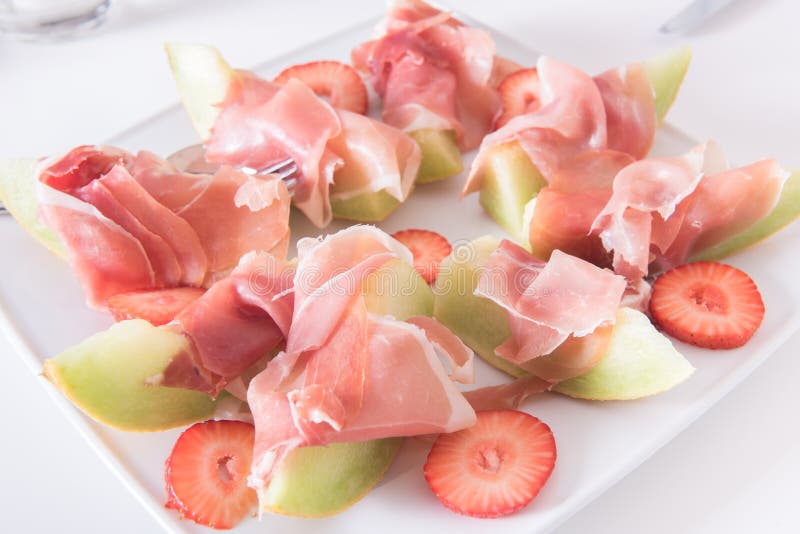 Ham and melon on a plate stock photo. Image of starter - 58859146