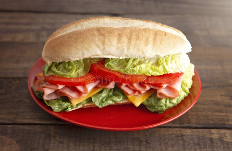 Ham Sandwich with Lettuce Cheese and Tomatoes on a White Bun Stock ... Ham Sandwich with Lettuce Cheese and Tomatoes on a White Bun Stock ...