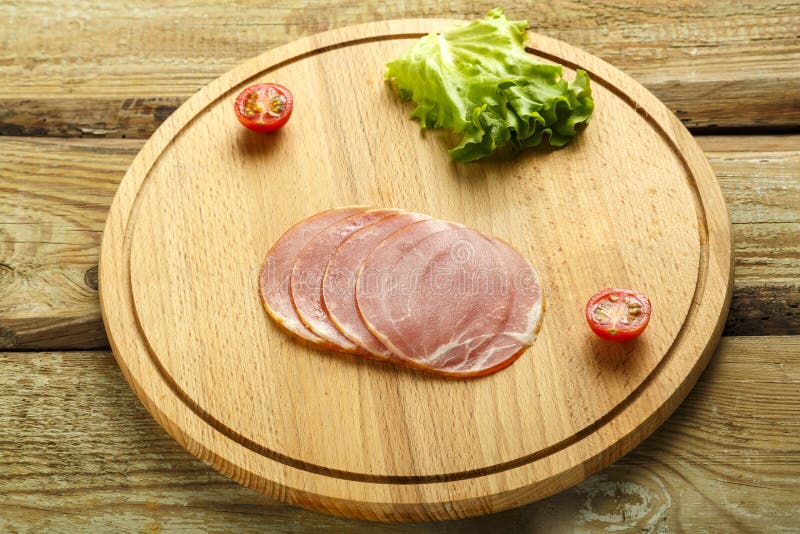 Ham Sliced on a Wooden Board on the Table. Horizontal Stock Image ...