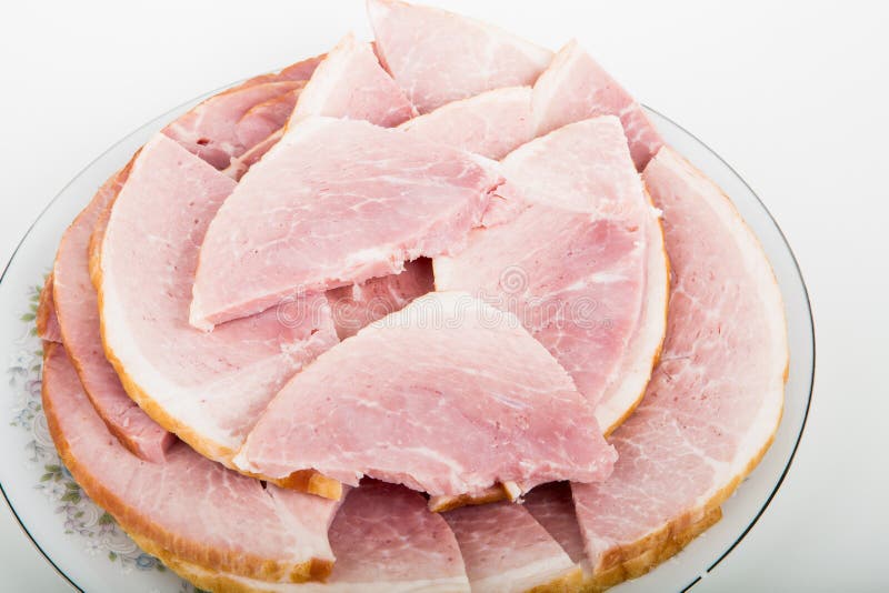 Slices of Ham on White Plate and Bamboo Mat Stock Image - Image of ...