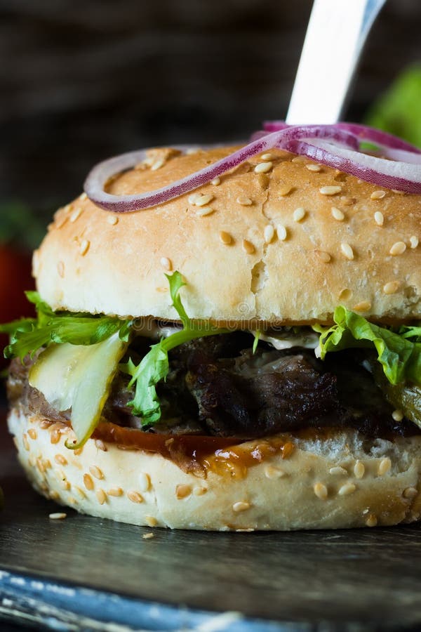 Hamburger with beef slices stock image. Image of onion - 102676861