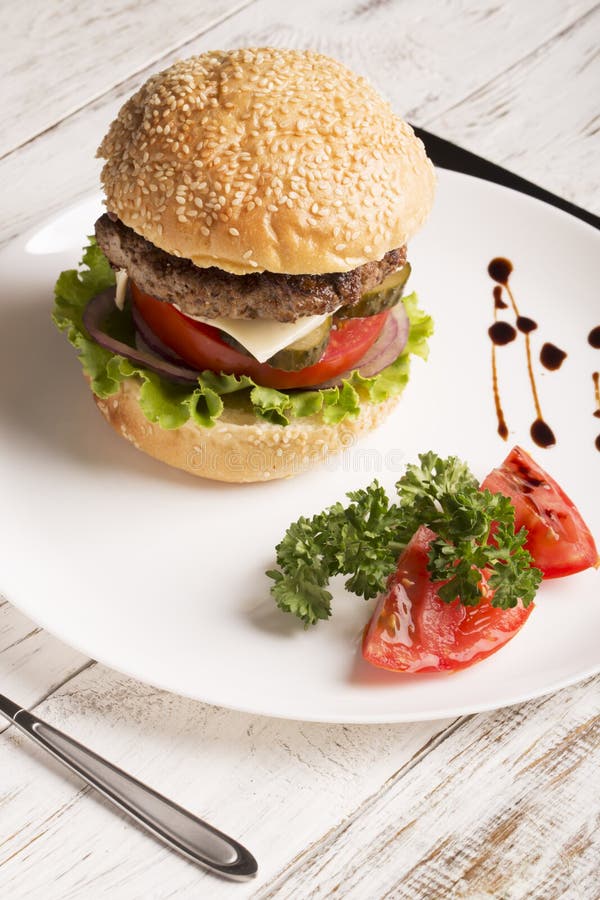 Hamburger on the plate stock image. Image of delicious - 56449153