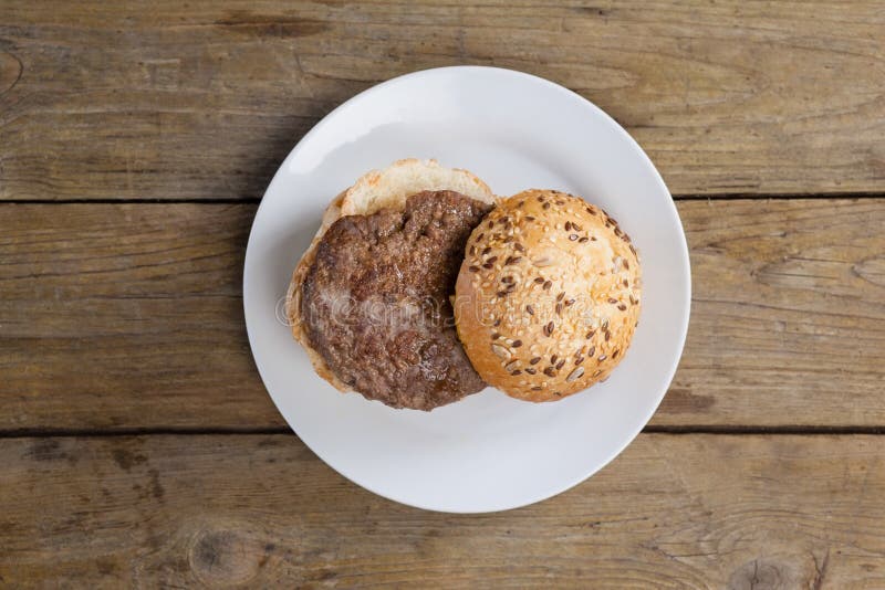 Hamburger in Plate on Wooden Table Stock Image - Image of meat, plate ...
