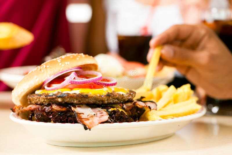 Hamburger in a restaurant stock image. Image of food - 21629763