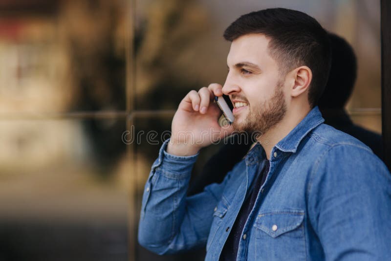 Hamdsome Beard Man Taking a Call on His Phone Stock Photo - Image of ...