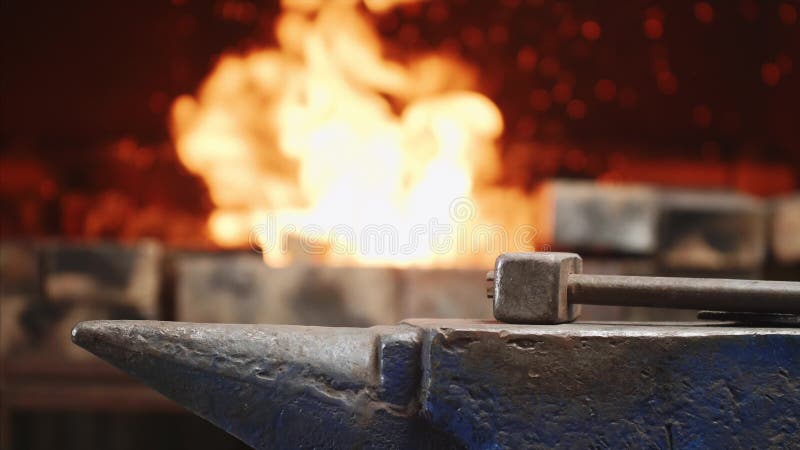 Hammer on Anvil in Forge on Fire Background in Which Worker Throws ...