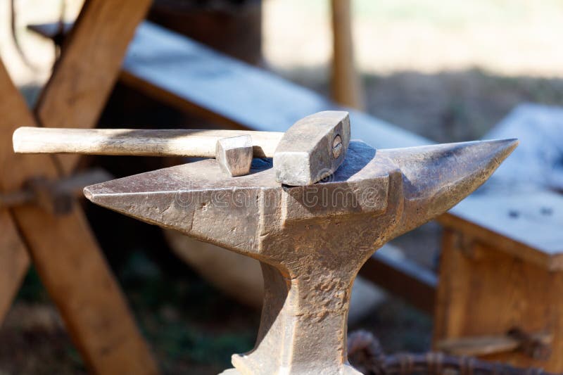 A Hammer and an Anvil are on a Table Stock Image - Image of steel, left ...
