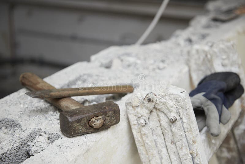 Hammer and Chisel on a Wall at a Construction Site Stock Photo - Image ...