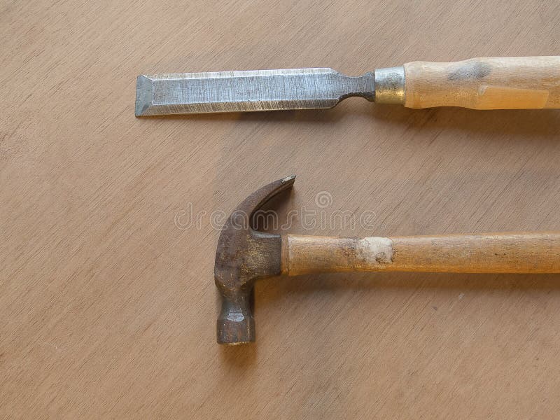 Hammer and Chisel on Wooden Table Background Stock Photo - Image of ...