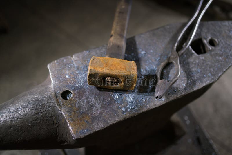 Hammer and Forceps Lie on the Anvil Stock Image - Image of handle ...