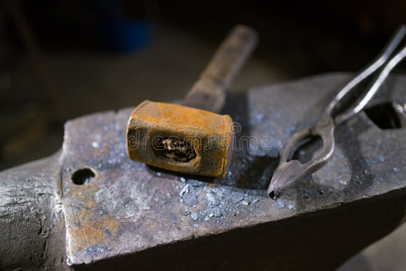 Hammer and Forceps Lie on the Anvil Stock Photo - Image of build, board ...
