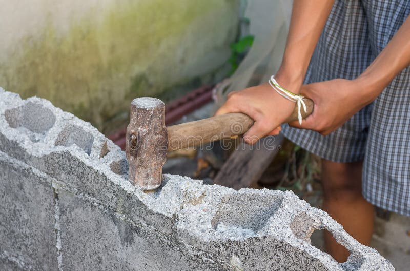 Hammer in Hand Breaking Brick Wall Stock Image - Image of entrance ...