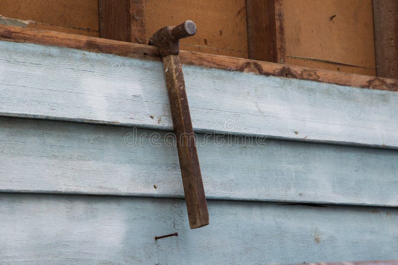 Hammer on the wall. stock image. Image of build, furniture - 109008843