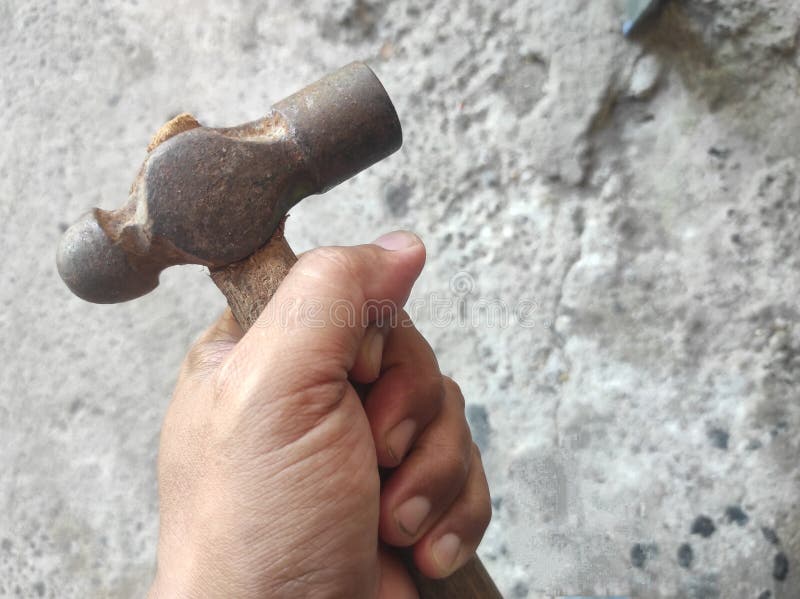 A hammer held by a person stock image. Image of iron - 262050781