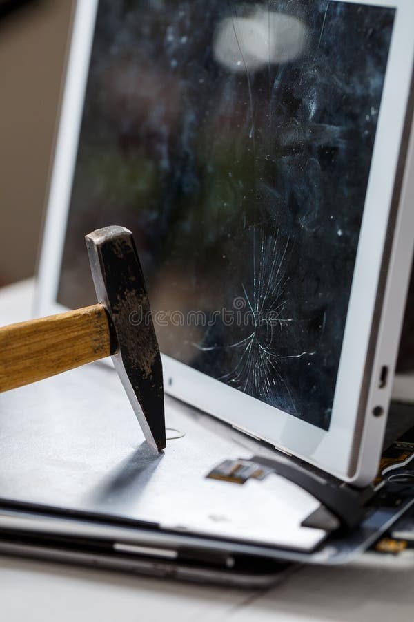 The hammer hits the broken stock photo. Image of screen - 353654104