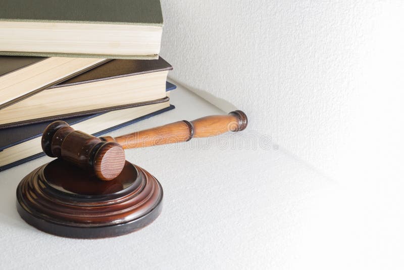 Hammer Judge on the Background of a Pile of Books, the Image on a Light ...