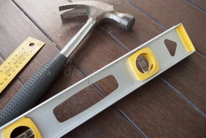 Hammer, Level and T Square Ruler on Timber Background Stock Image ...