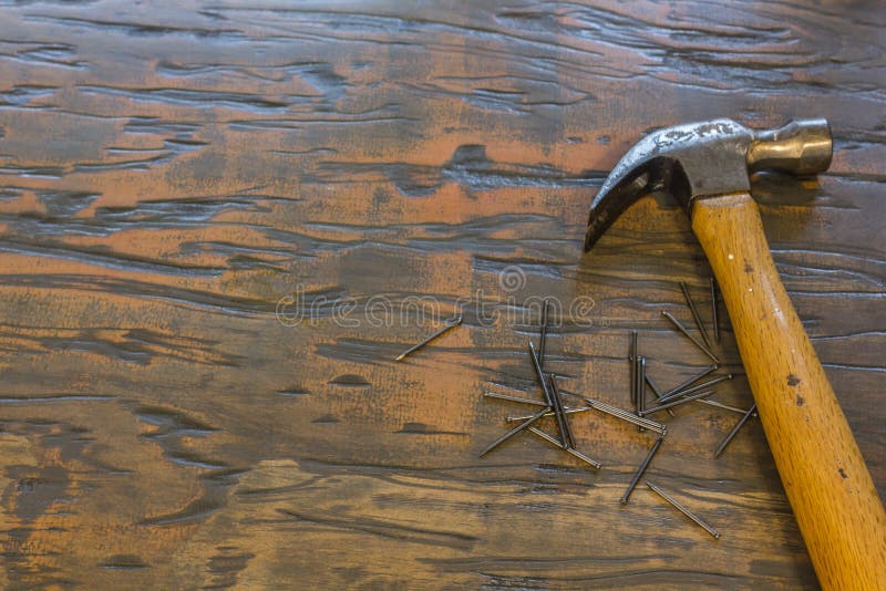 Hammer and Nails on Wood Table Stock Image - Image of closeup, inside ...