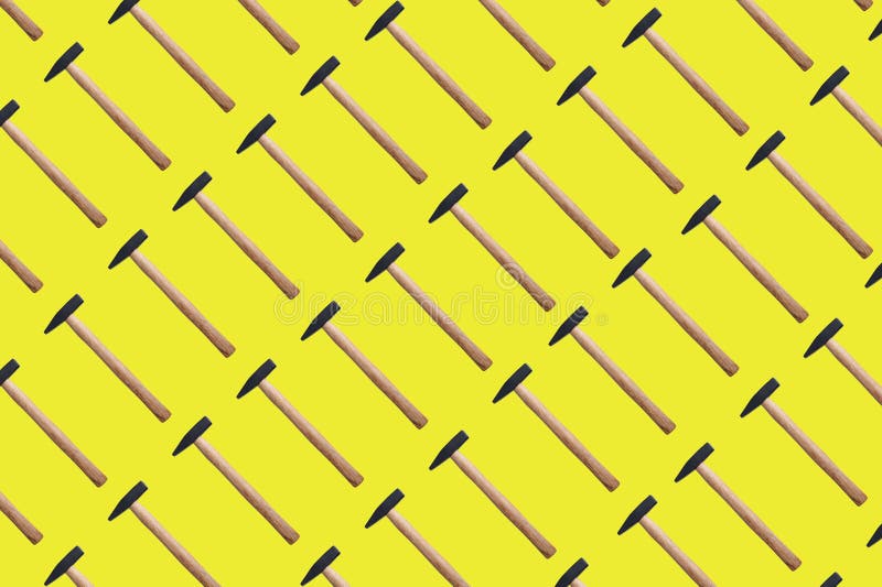Hammer Pattern on a Yellow Background. Hammers are Repeated Many Times ...