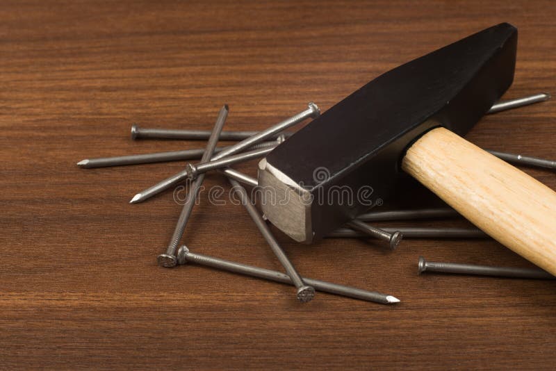 Hammer and Set of Nails on Table Stock Image - Image of nails ...