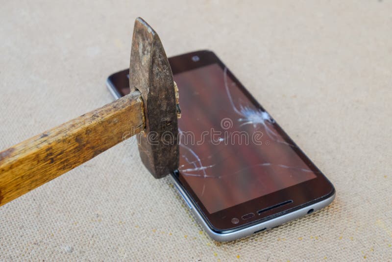 Hammer and Smartphone. the Screen of the Smartphone, a Broken Ha Stock ...