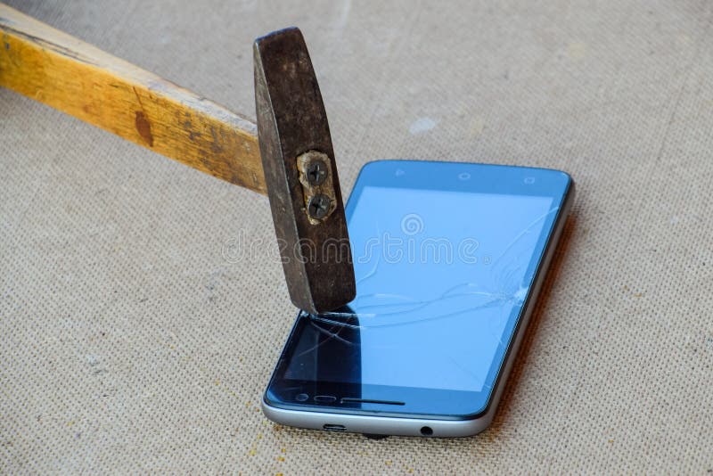 Hammer and Smartphone. the Screen of the Smartphone, a Broken Ha Stock ...