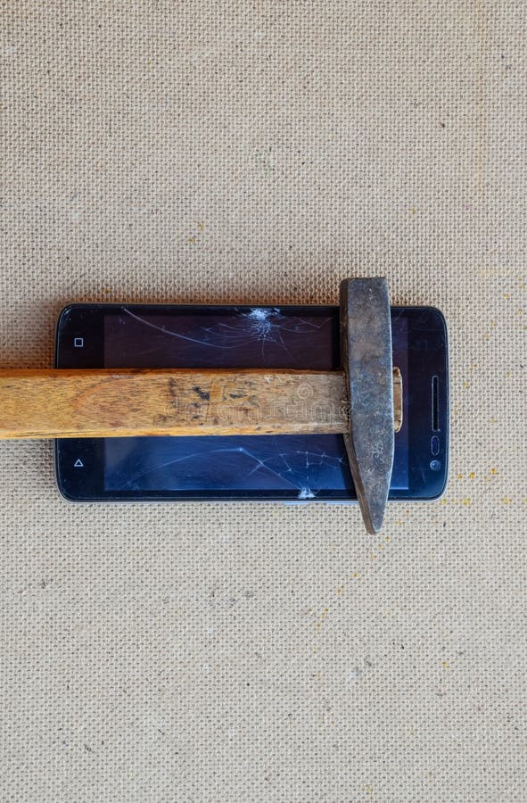 Hammer and Smartphone. the Screen of the Smartphone, a Broken Ha Stock ...