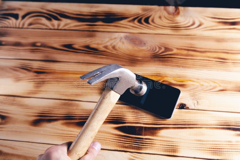 Hammer and Smashed Phone on the Table Stock Photo - Image of device ...