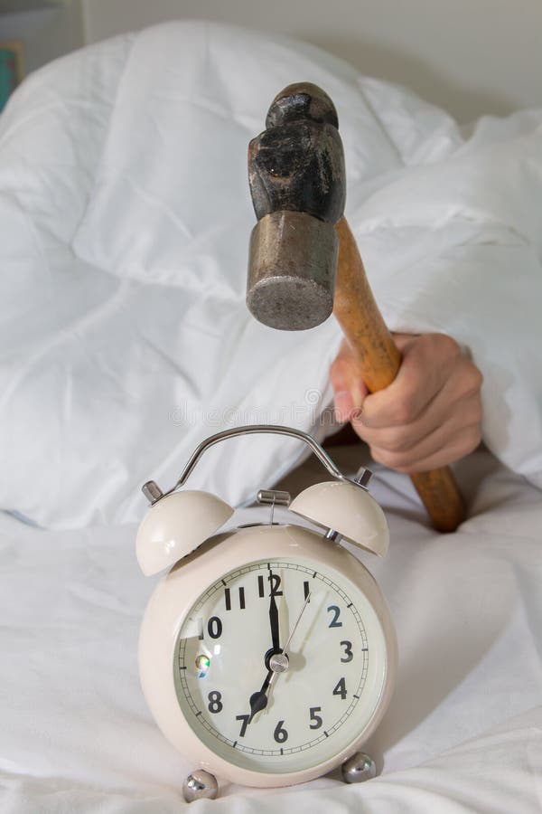 Smashing an Alarm Clock stock photo. Image of doze, slumber - 1099004