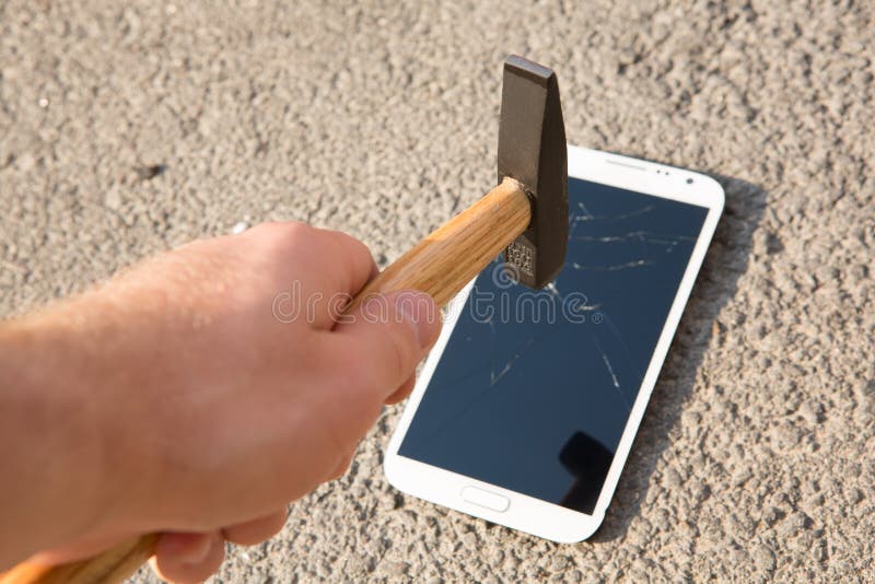Hammer Smashing the Screen of a Smartphone Stock Photo - Image of ...