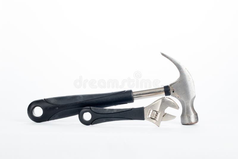 A Hammer and a Spanner with Black Rubber Handle Isolated on White ...
