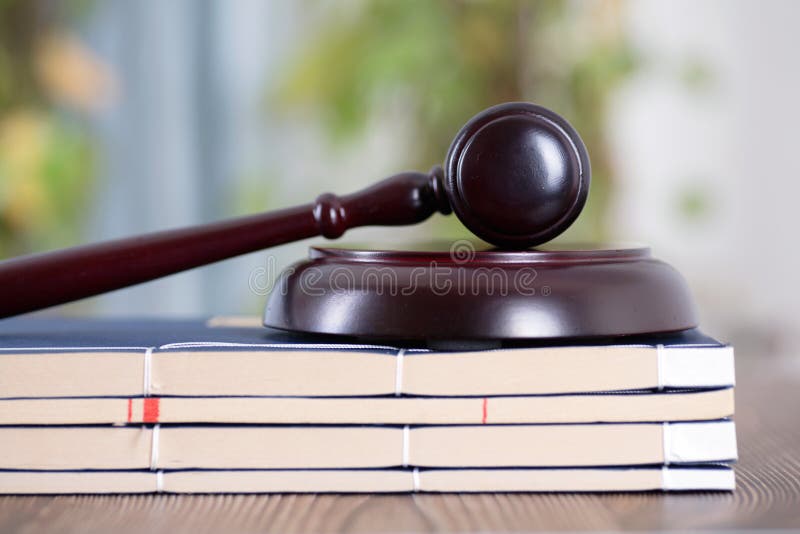 Hammer on a stack of books stock photo. Image of culture - 229727460