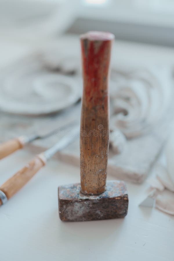 Hammer on Table Near Sculptures in Workshop of Sculptor Stock Image ...