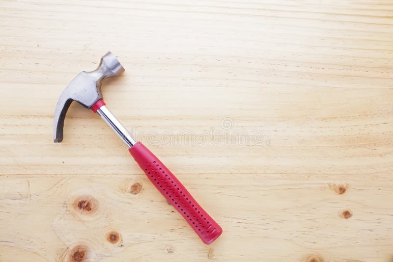 A hammer on a wood table stock image. Image of handyman - 59807213