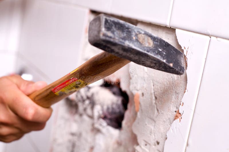 Hammering Away on Wall Tiles Stock Photo - Image of tiles, hands: 15579094