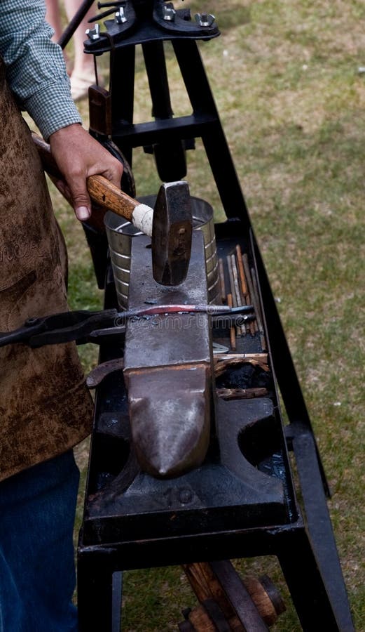 Hammering metal stock image. Image of blacksmith, profession - 12467191
