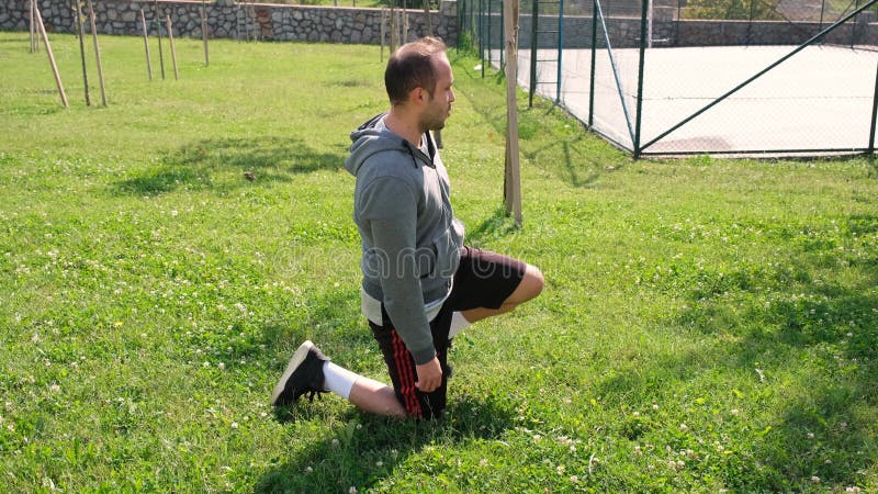 Hamstring Stretch, Young Man is Doing the Exercise by Hamstring Stretch ...