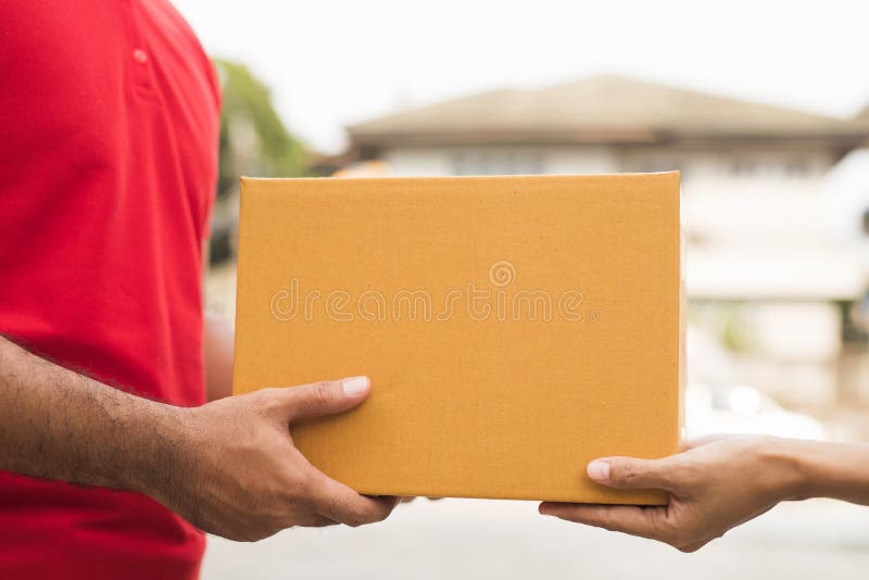 Hand Accepting a Delivery of Boxes from Deliveryman Stock Image - Image ...