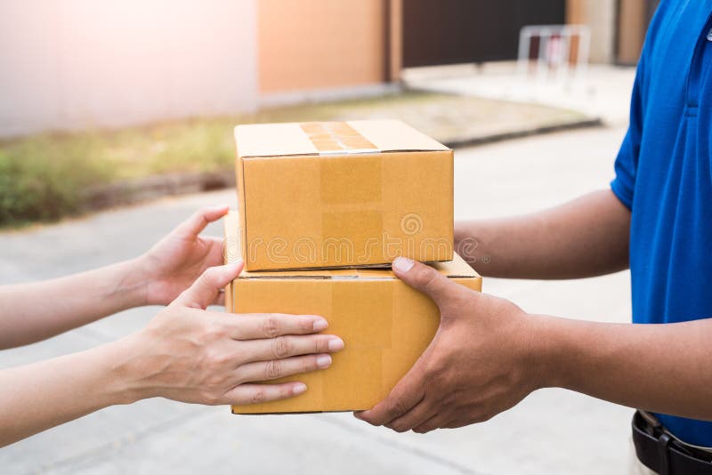 Male Hand Accepting a Delivery of Boxes from Deliveryman. Stock Image ...