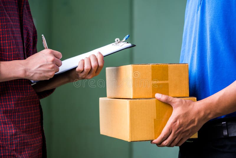 Male Hand Accepting a Delivery of Boxes from Deliveryman. Stock Photo ...