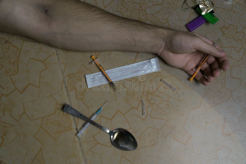 The Hand of the Addict is Lying on the Floor after Taking the Dose ...