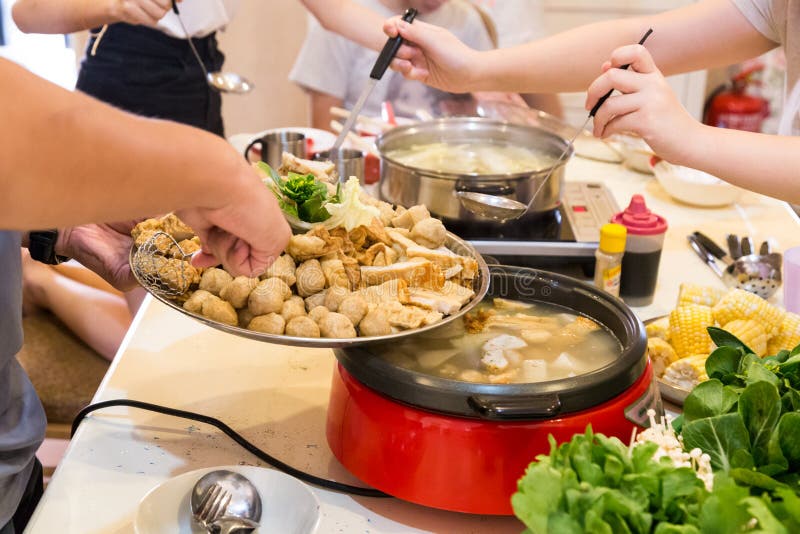 Hand Adding Ingredient into Asian Steamboat Pot Meal Stock Photo ...