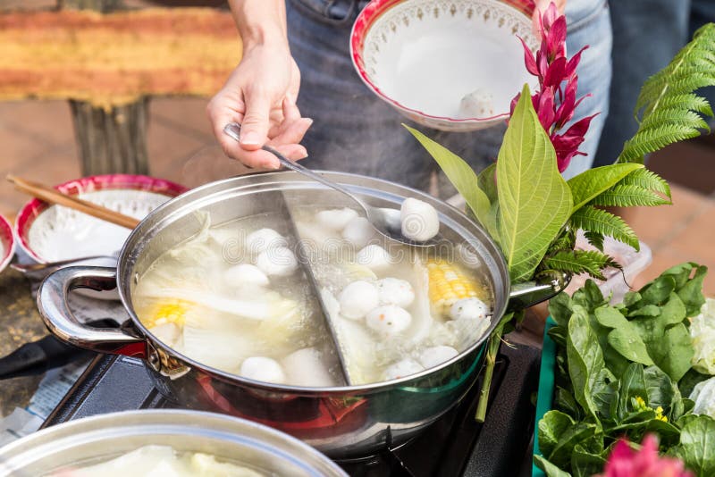 Hand Adding Ingredient into Asian Steamboat Pot Meal Stock Photo ...