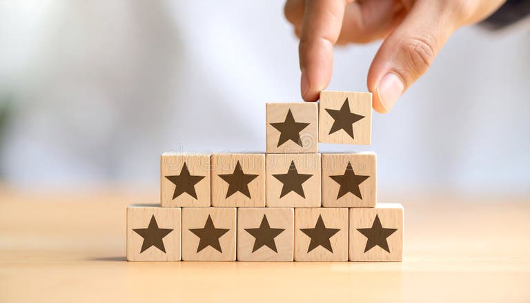 Hand Adding a Star Block, Completing a Pyramid of Five-star Ratings, Symbolizing Quality Stock ...