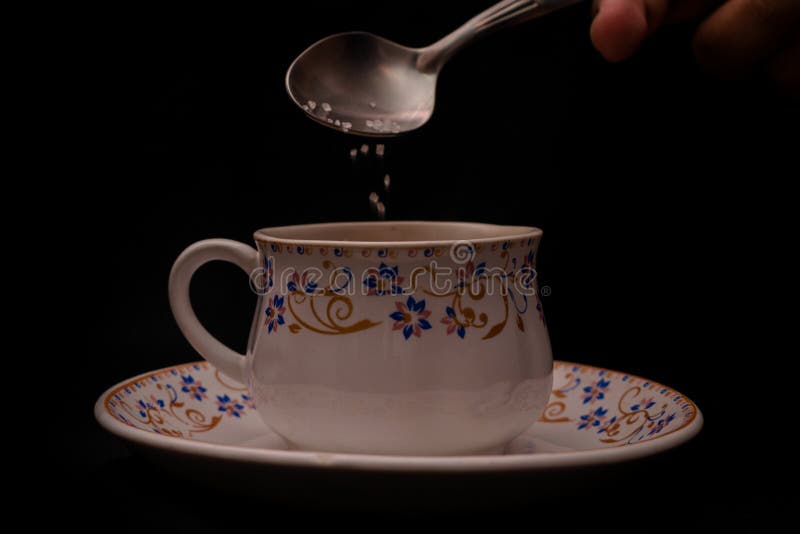 Hand Adding Sugar To a Cup of Tea Stock Photo - Image of bottle, table ...