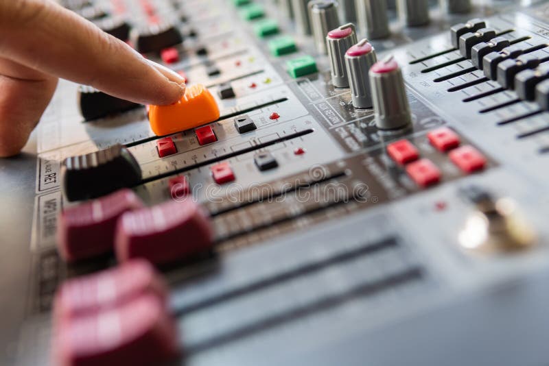 Hand adjusting audio mixer stock image. Image of professional - 143464833