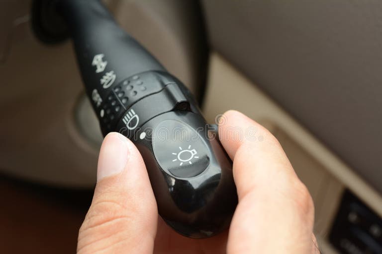 Hand Adjusting Car Headlight Control Switch Stock Photo - Image of ...