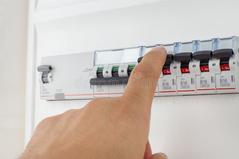Hand Adjusting Circuit Breakers on Panel Stock Photo - Image of ...