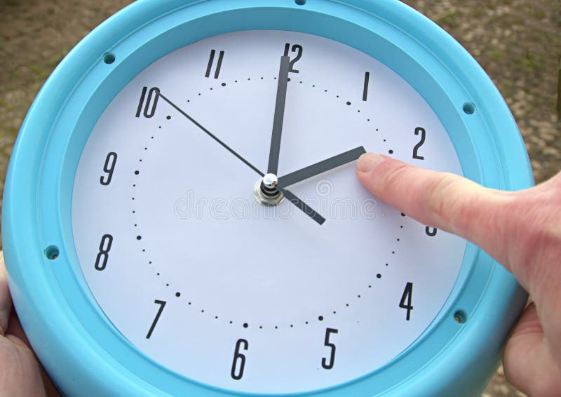 Hand Adjusting the Time on a Clock Stock Photo - Image of movement ...